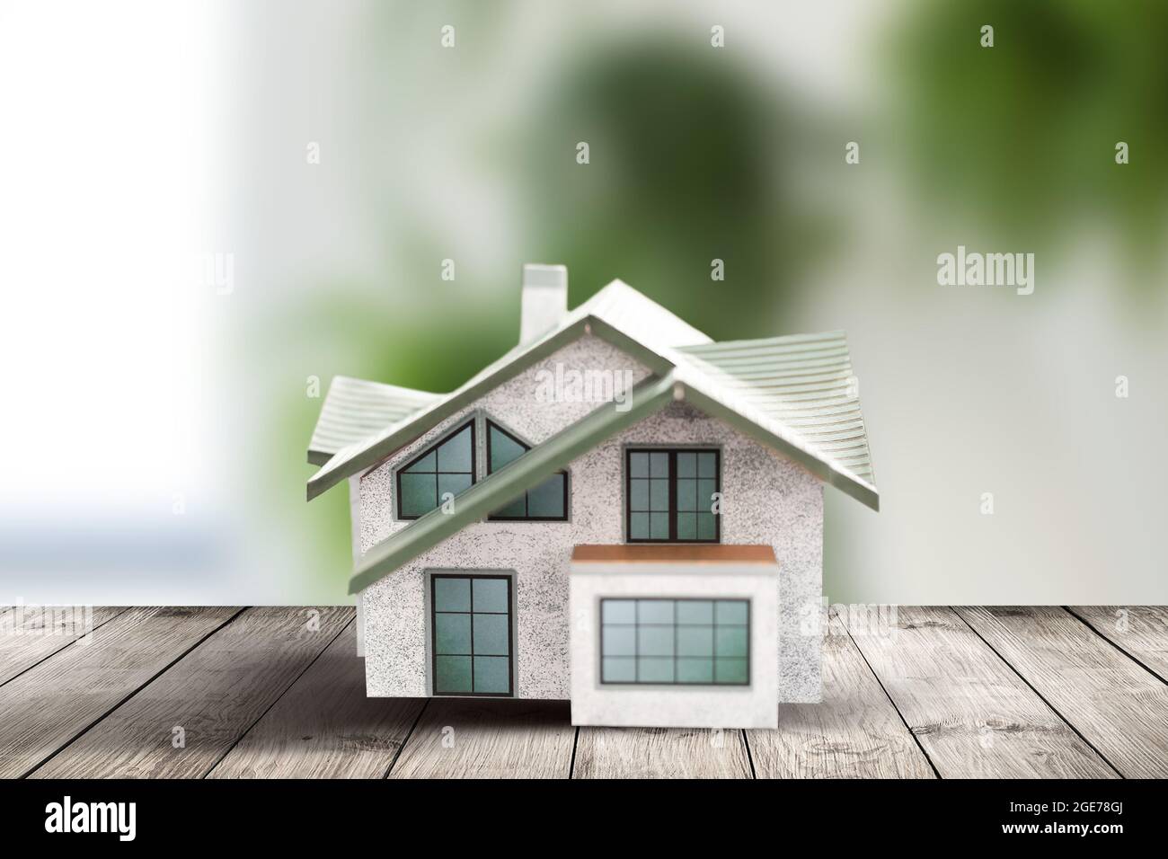 Small white cardboard houses on white background. Handmade home. Do it ...