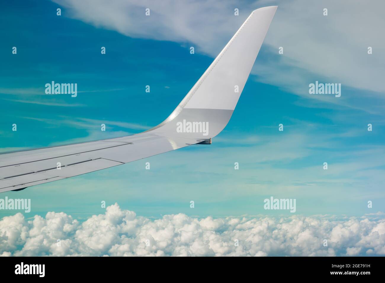 Plain wing over blue sky. Flight from Helsinki to Amsterdam Stock Photo ...
