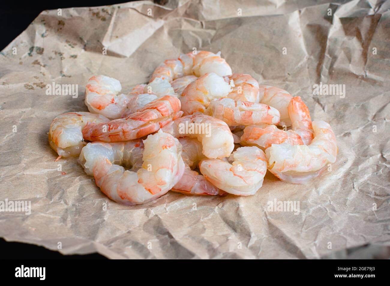 Raw Shrimp on Brown Butchers Paper: Uncooked peeled and deveined shrimp ...