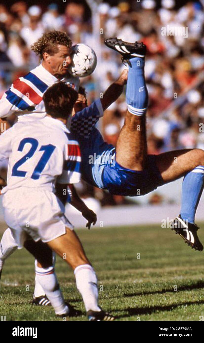 Cle Kooiman and Fernando Clavijo (21) of the USA watch an overhead kick ...