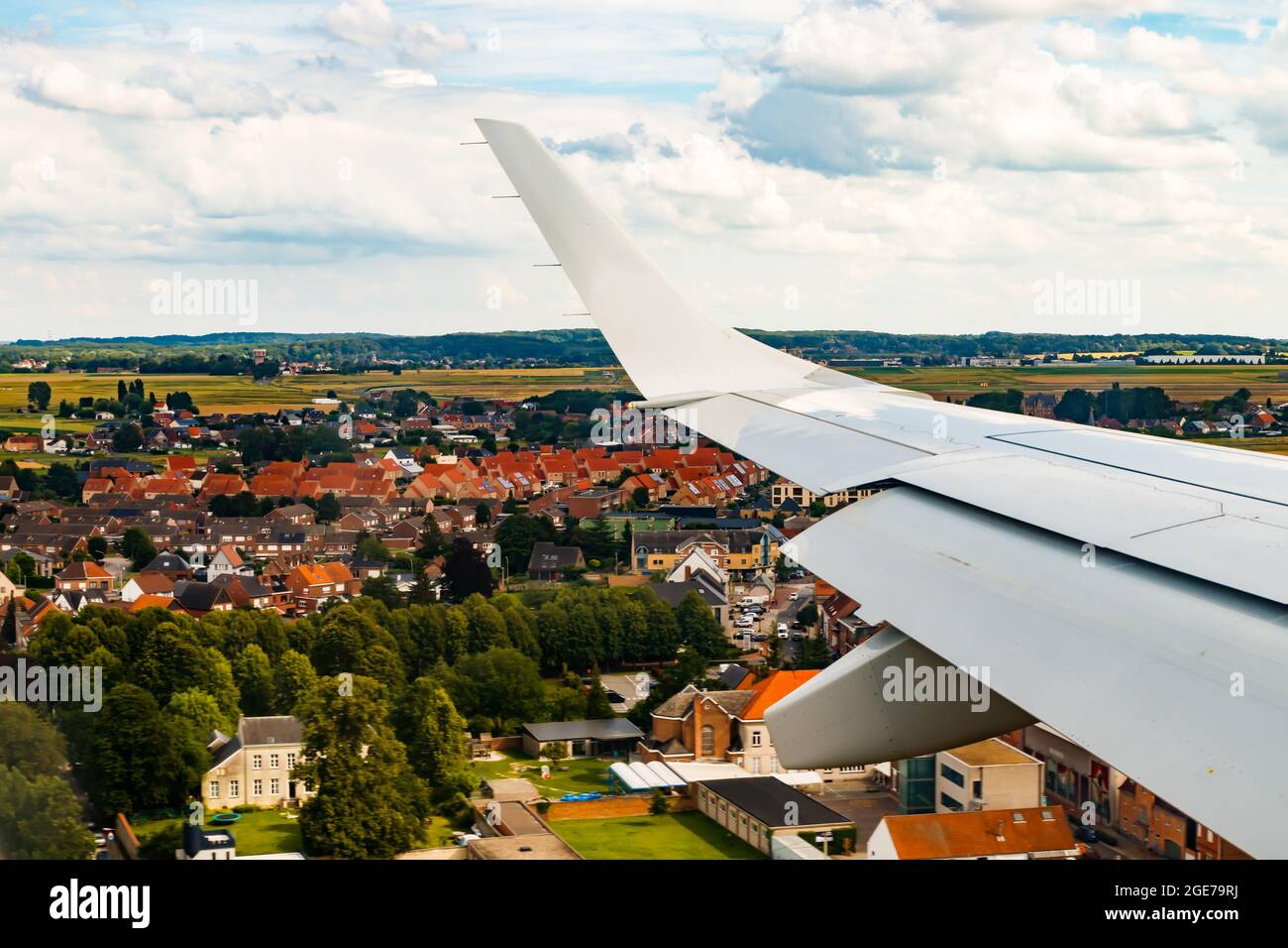 Plain wing over Belgium. Flight from Amsterdam to Brussels Stock Photo ...