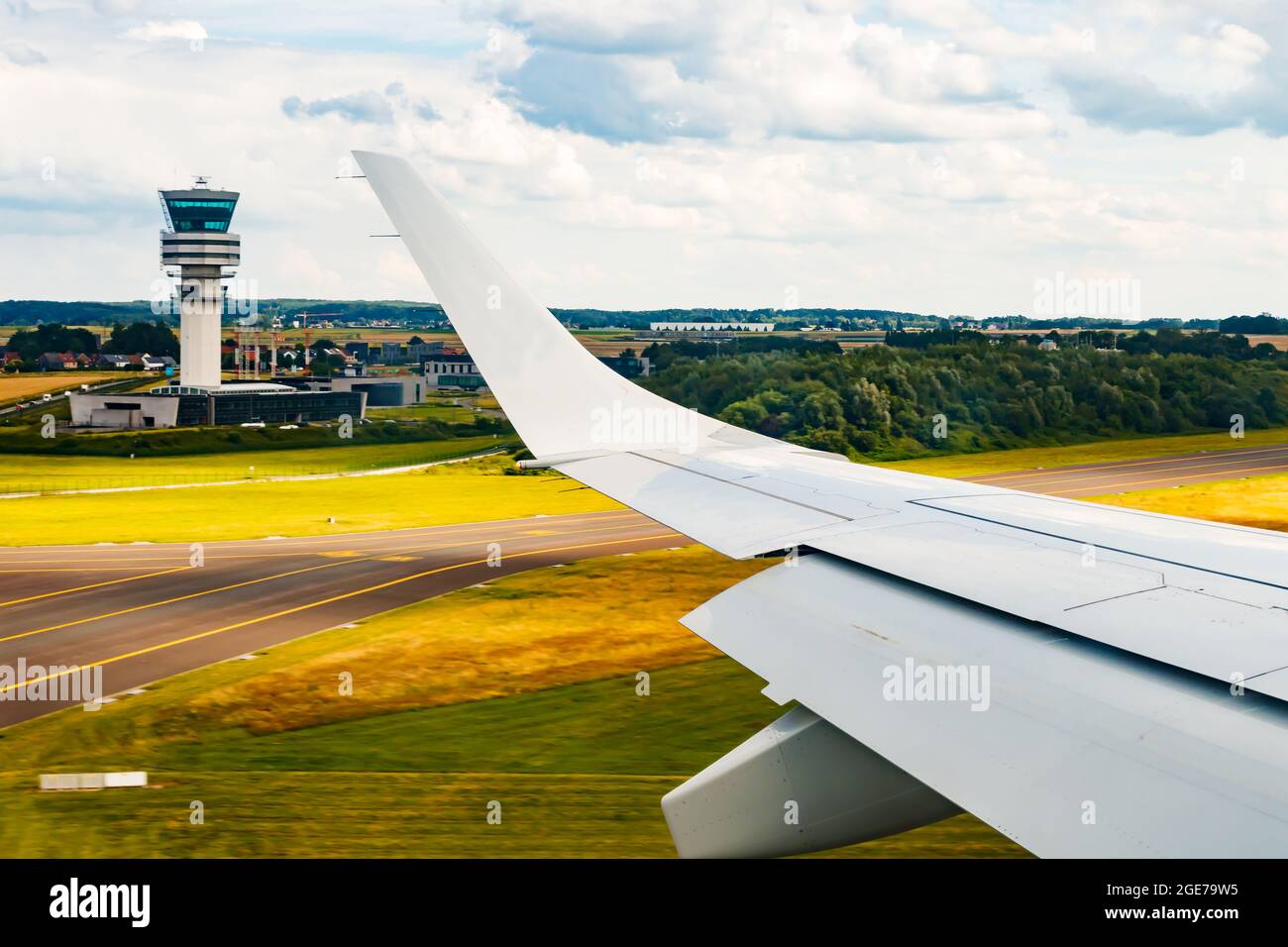 Plain wing over Belgium. Flight from Amsterdam to Brussels Stock Photo ...