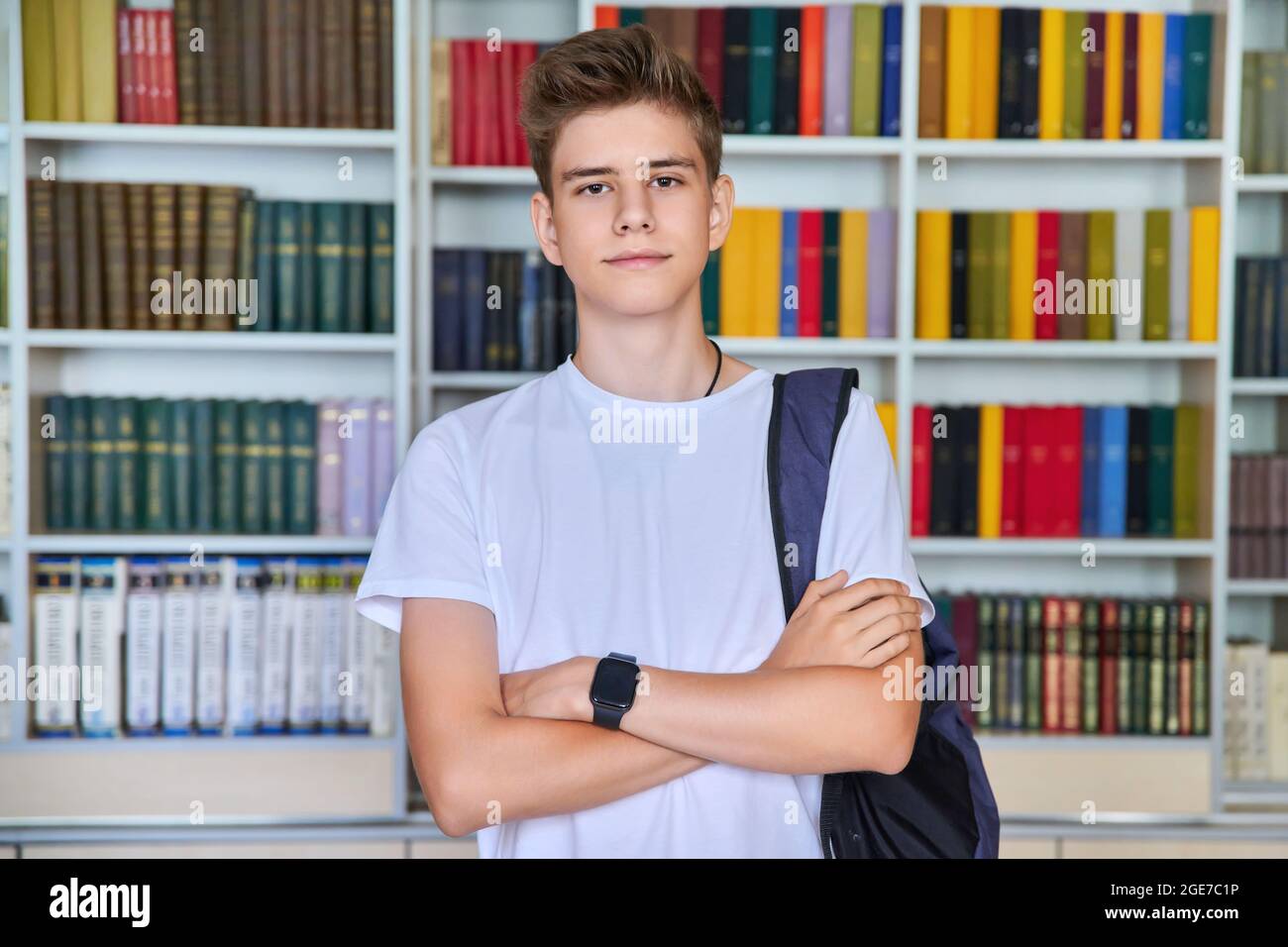 Single portrait of serious confident male student teenager looking at ...