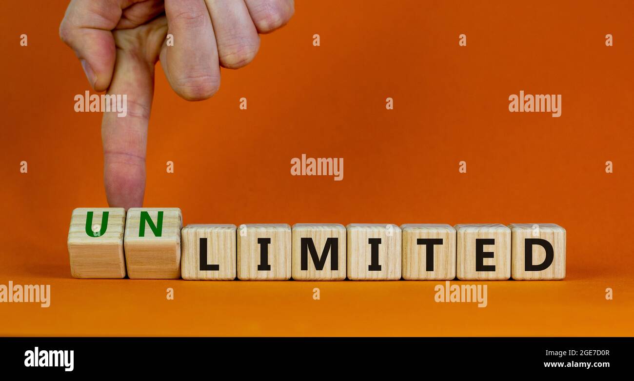 Limited or unlimited symbol. Businessman turns cubes, changes words ...