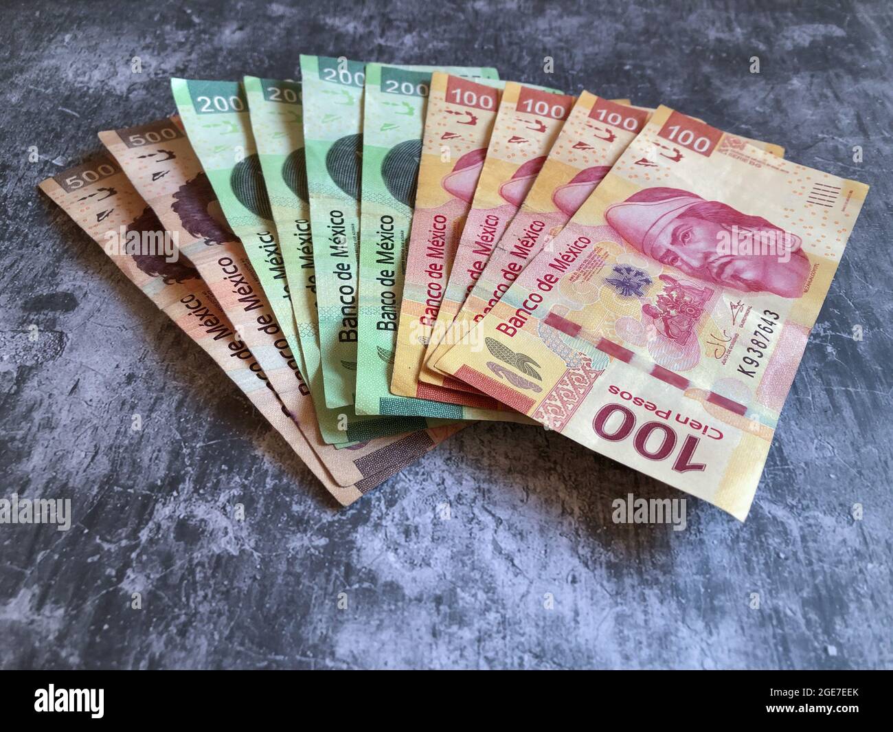 Closeup of Mexican currency banknotes on the grunge gray surface Stock ...