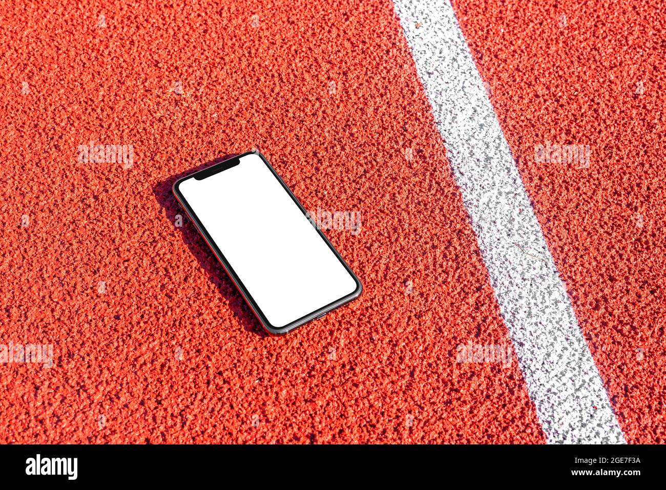 Phone with isolated display for sport app promotion on running track ...