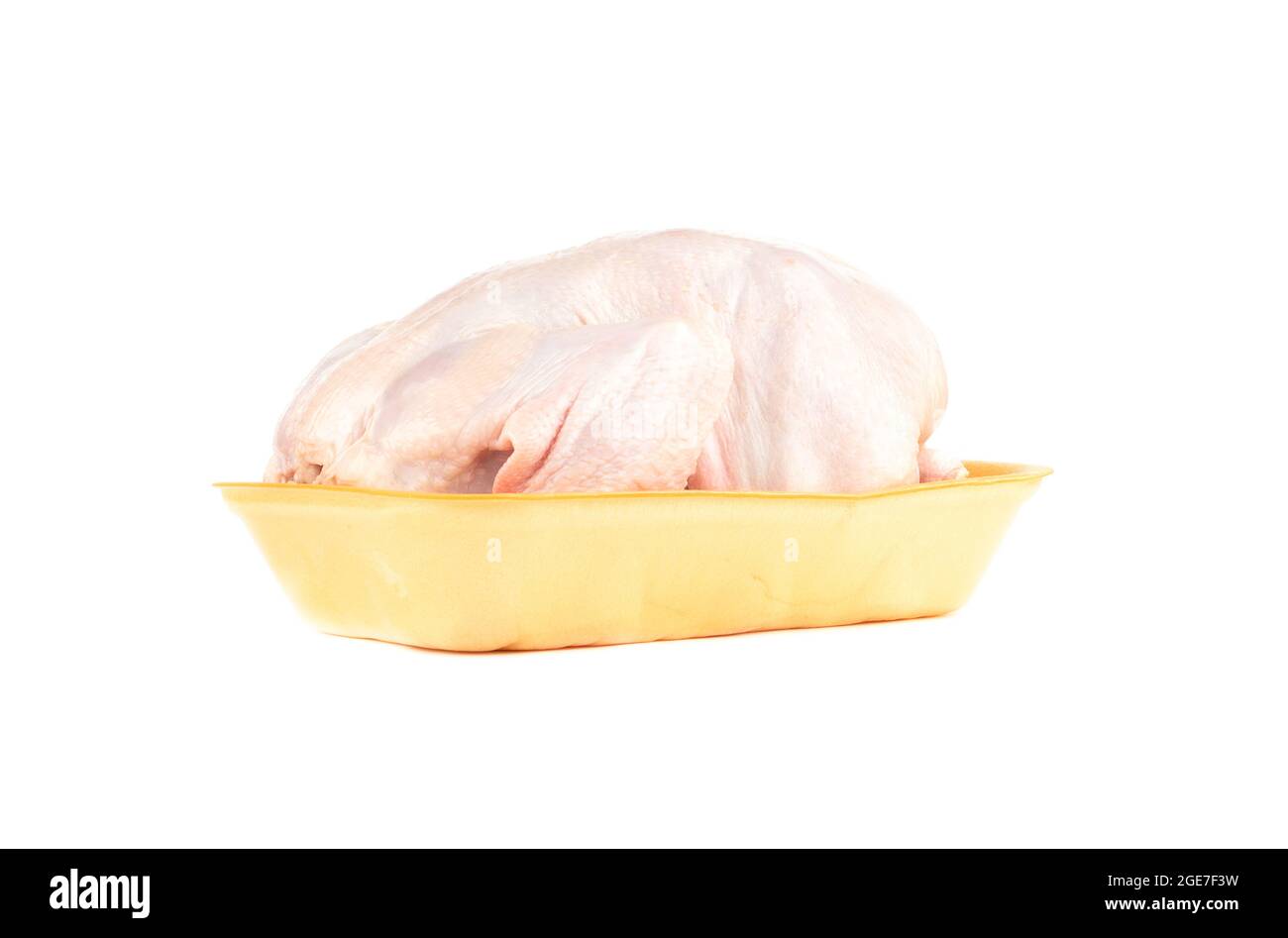 Whole fresh chicken in a plastic tray over a white background. Copy ...