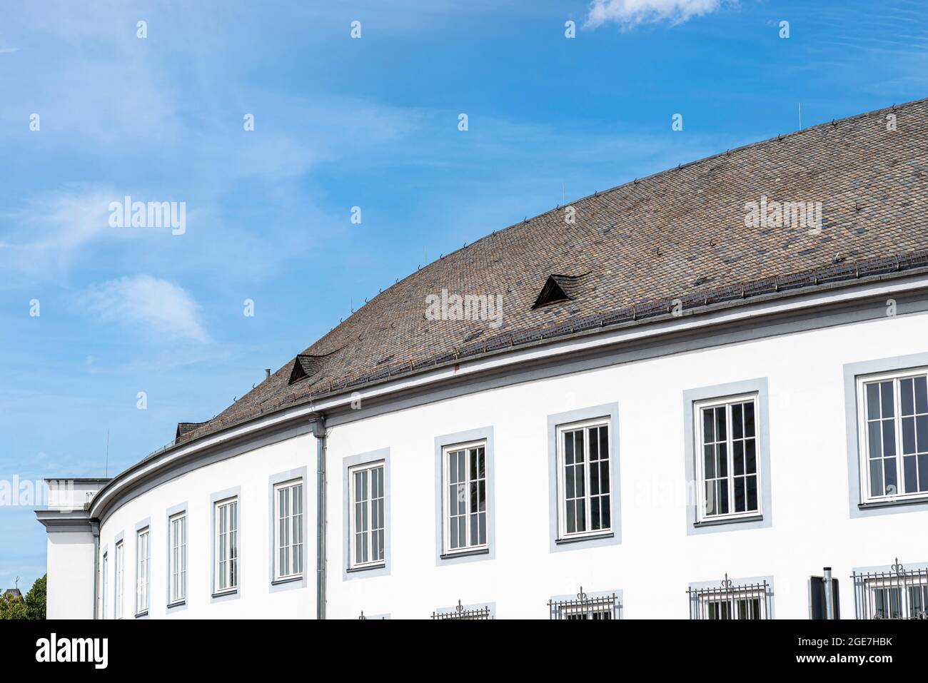 The Large round roof is covered with the flat tile of an old house with ...