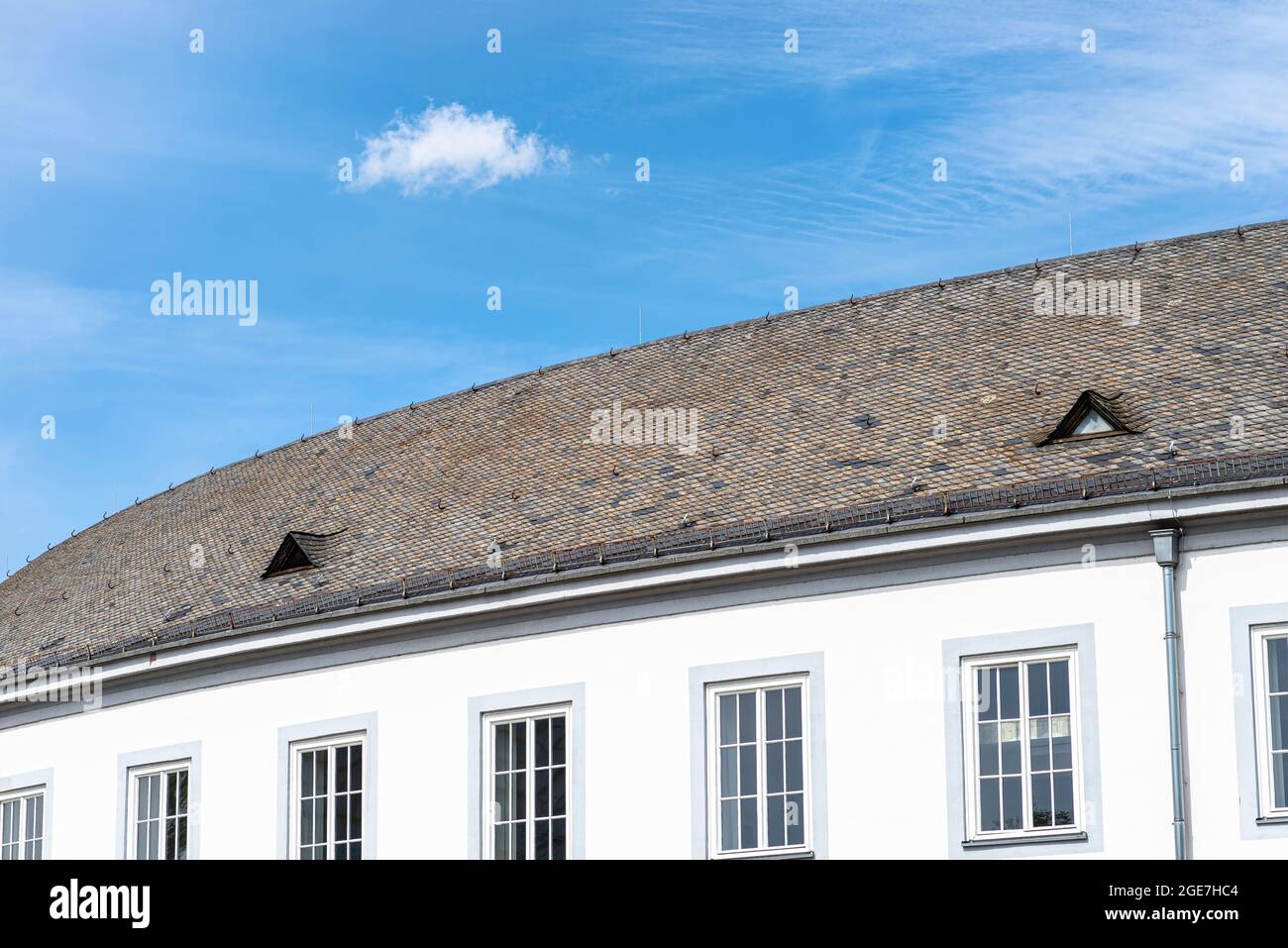 The Large round roof is covered with the flat tile of an old house with ...