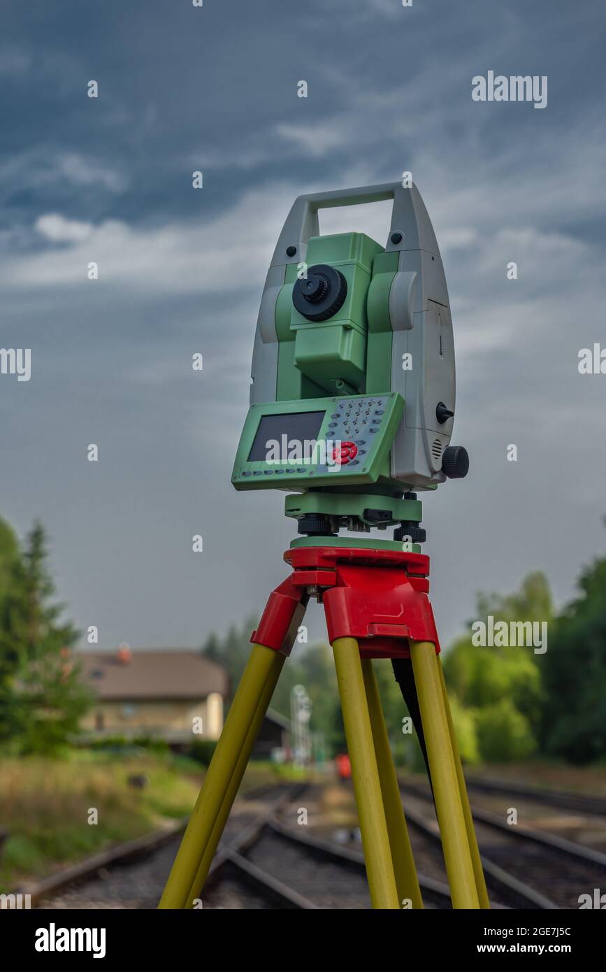 Machine for surveyors with blue sky and green trees in sunny color day ...