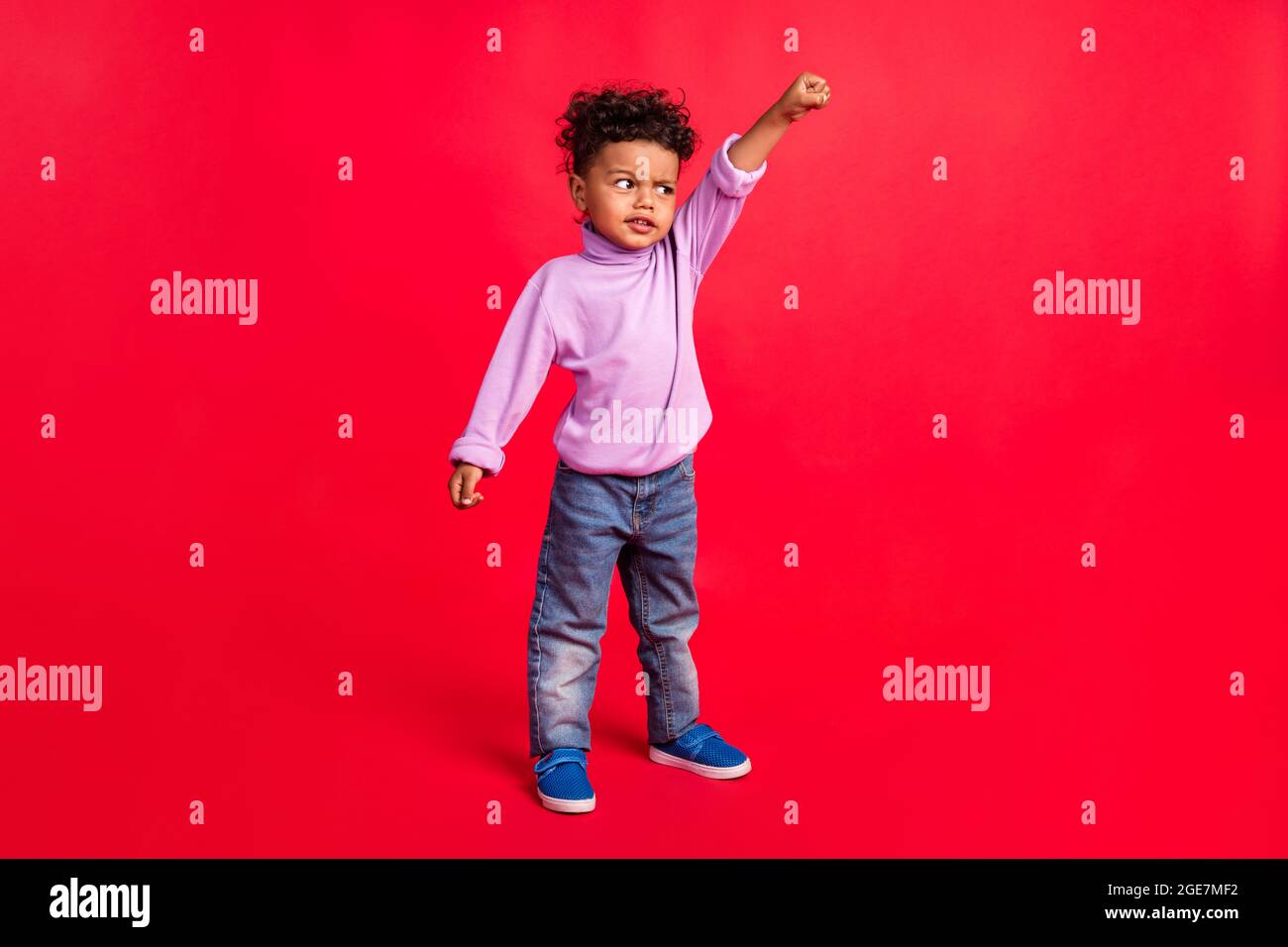 Full length body size view of attractive funny kid striving struggling ...