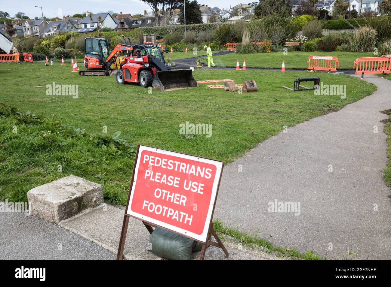 Warning sign diverting pedestrians from a footpath undergoing ...