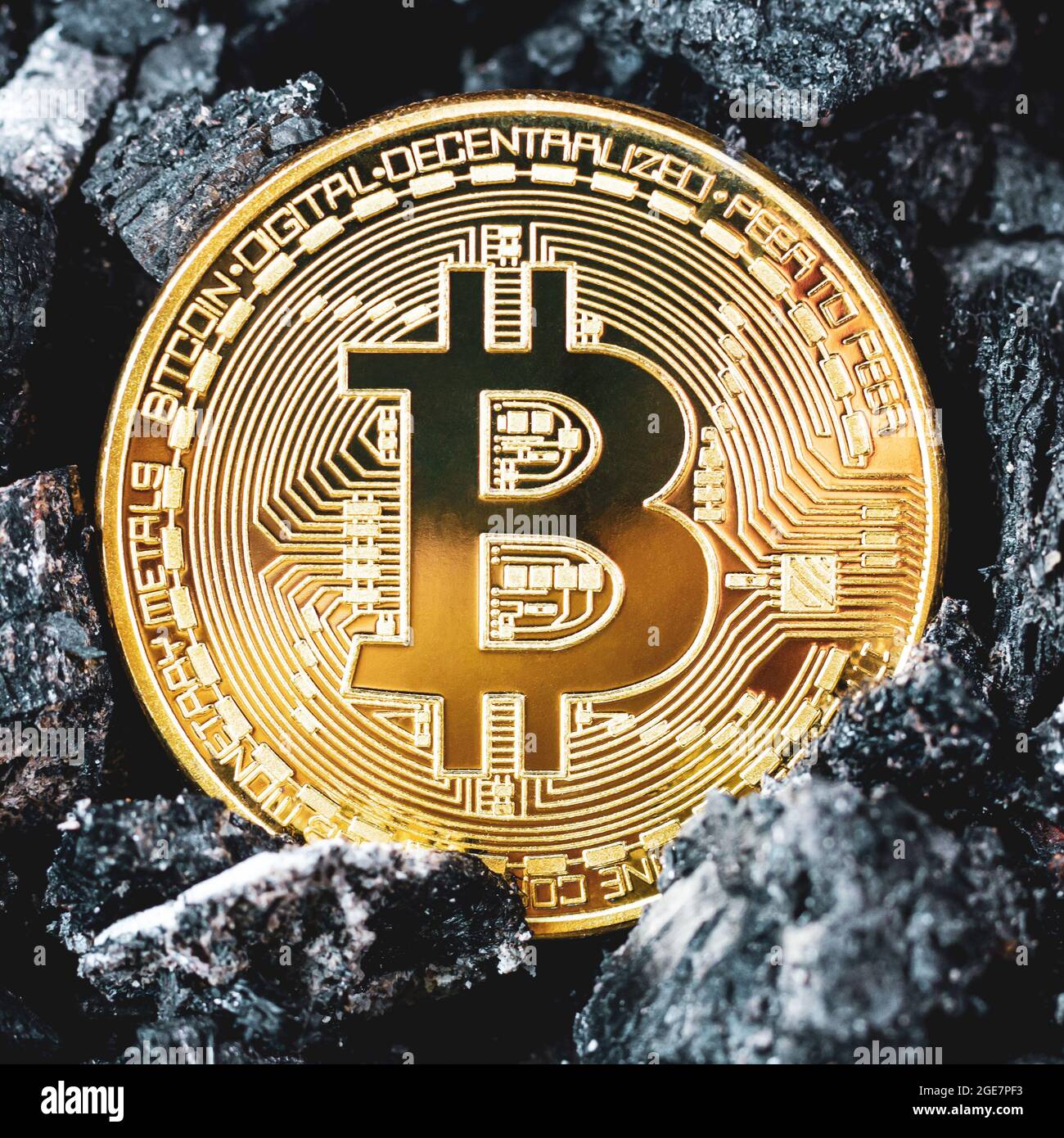 Gold bitcoin coin on a black coal background. Gold btc. Bitcoin ...