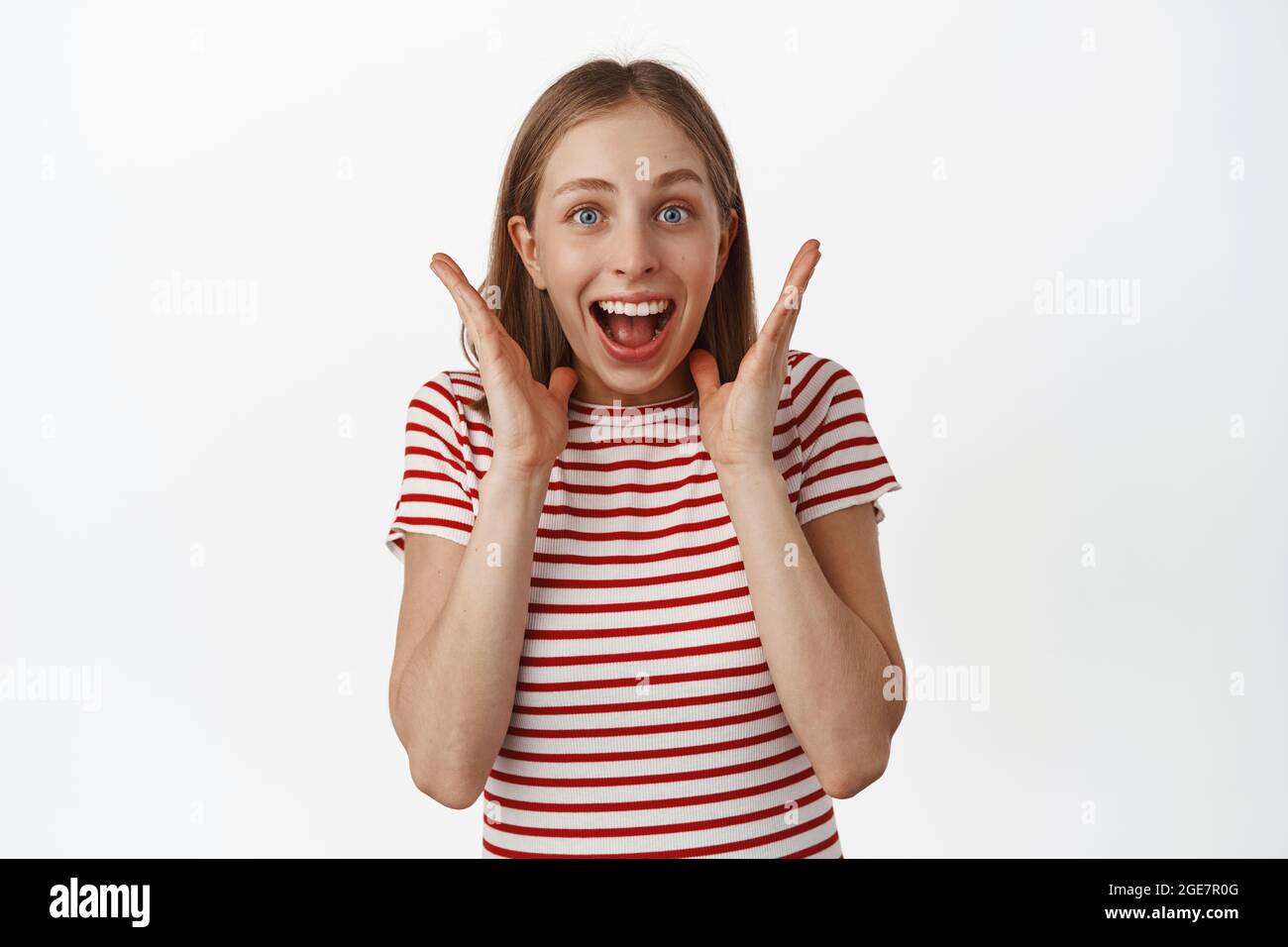 Image of excited and surprised young woman rejoice over big surprise ...