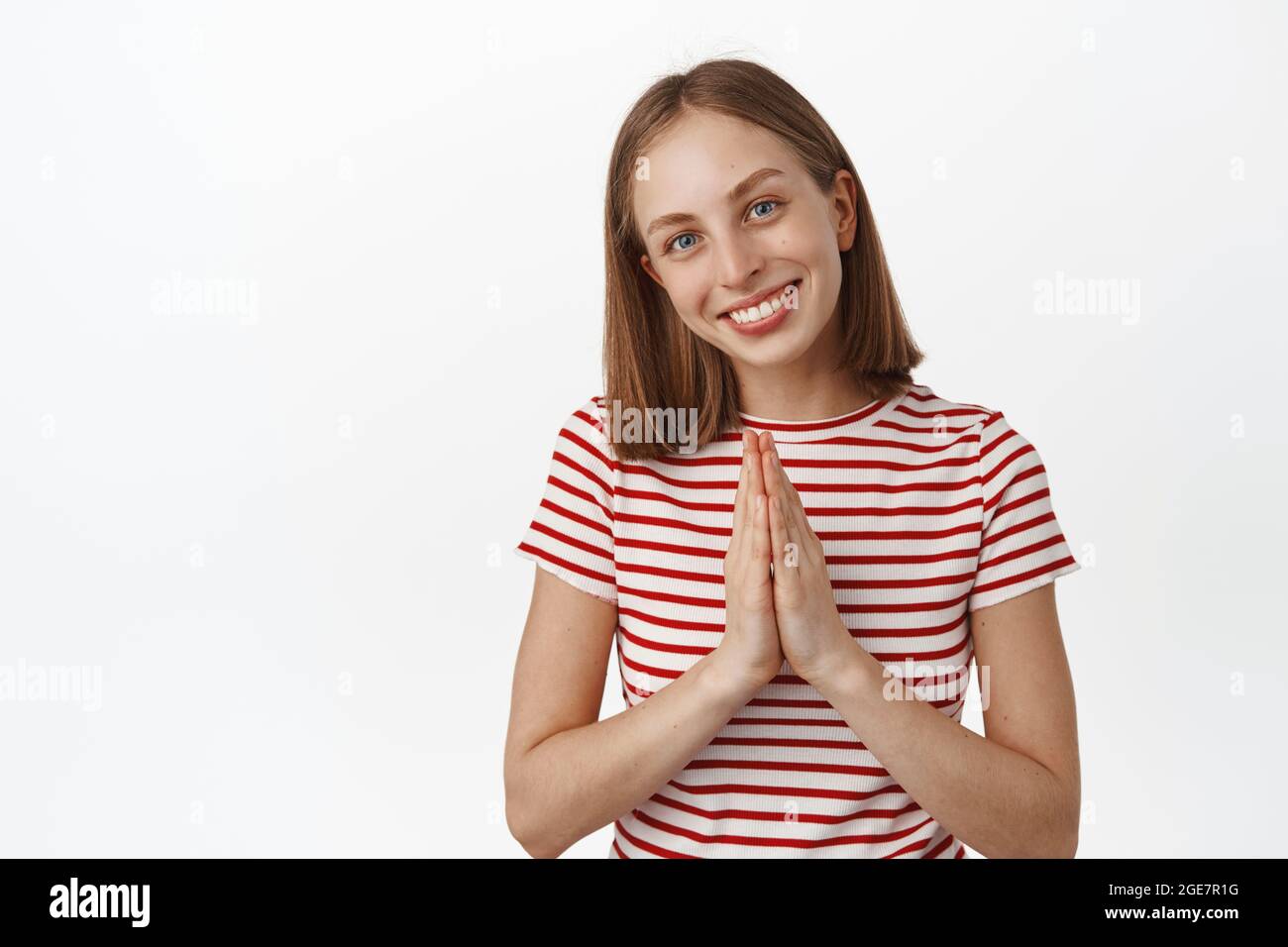 Thank you. Pleasant smiling blond woman show namaste, appreciation ...