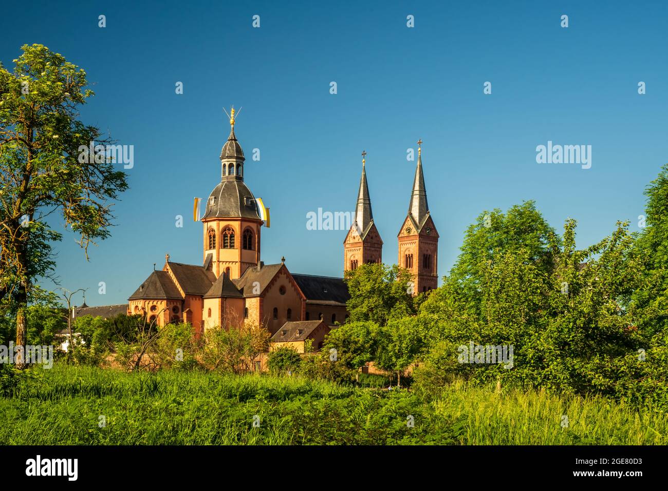 Ancient Einhard-Basilika with its two Romanesque Revival towers against ...