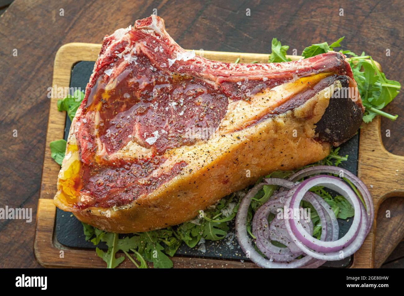 Delicious aged raw black angus beef steak ready-to-be-cooked on a ...