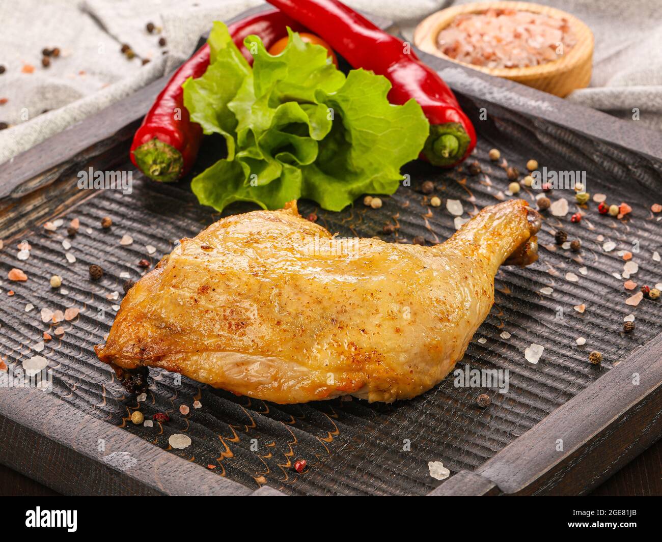 Roasted chicken leg with herbs and spices Stock Photo - Alamy