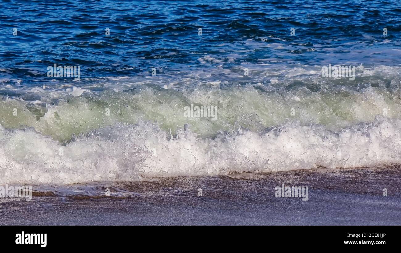 Sea waves ending at the beach Stock Photo - Alamy