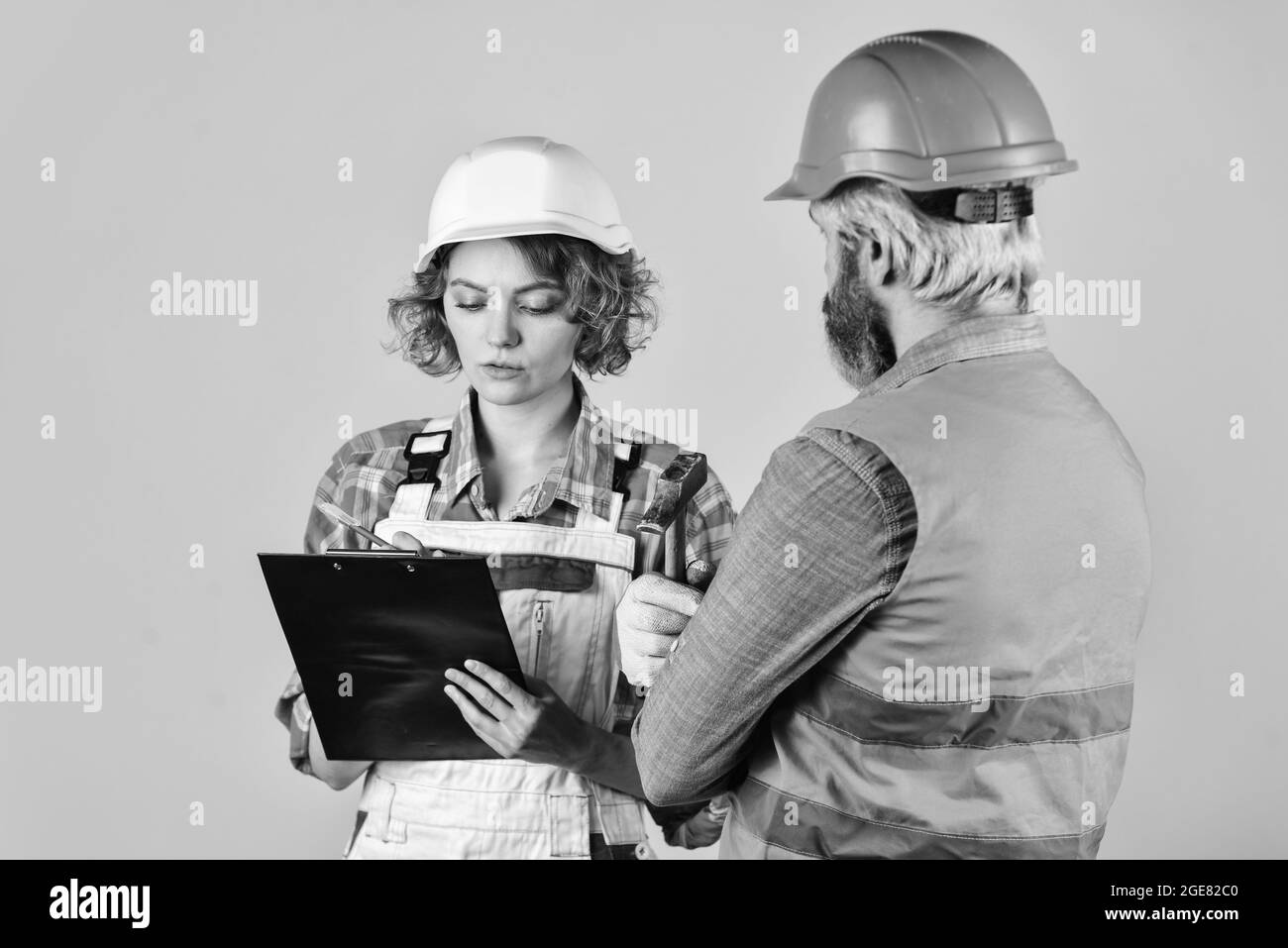 An architect looking at blueprint plans Black and White Stock Photos ...