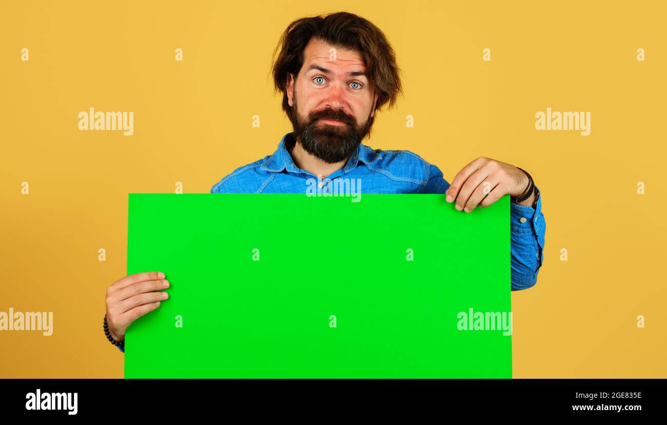Bearded man with empty sign board. Smiling male with advertising banner ...