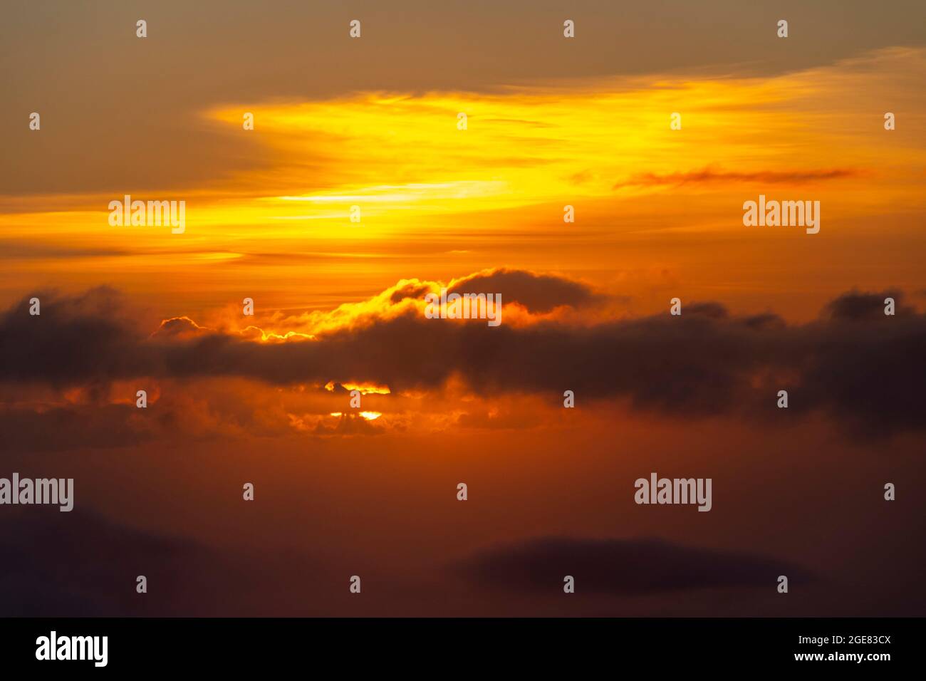 Sunset behind clouds, near Moonlight Tops Hut, Paparoa Track, (one of ...