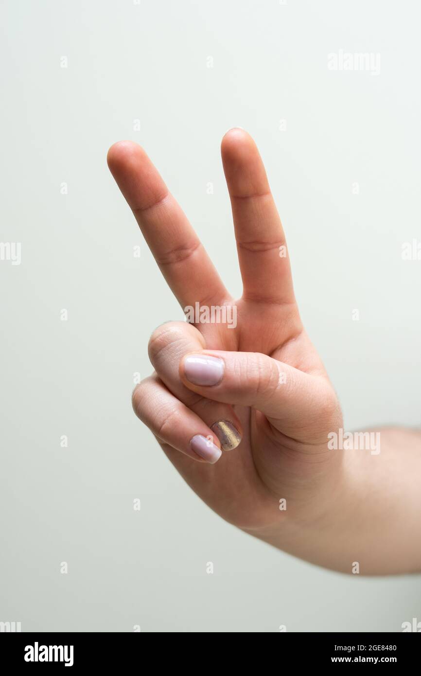 Closeup of two fingers showing the victory sign Stock Photo - Alamy