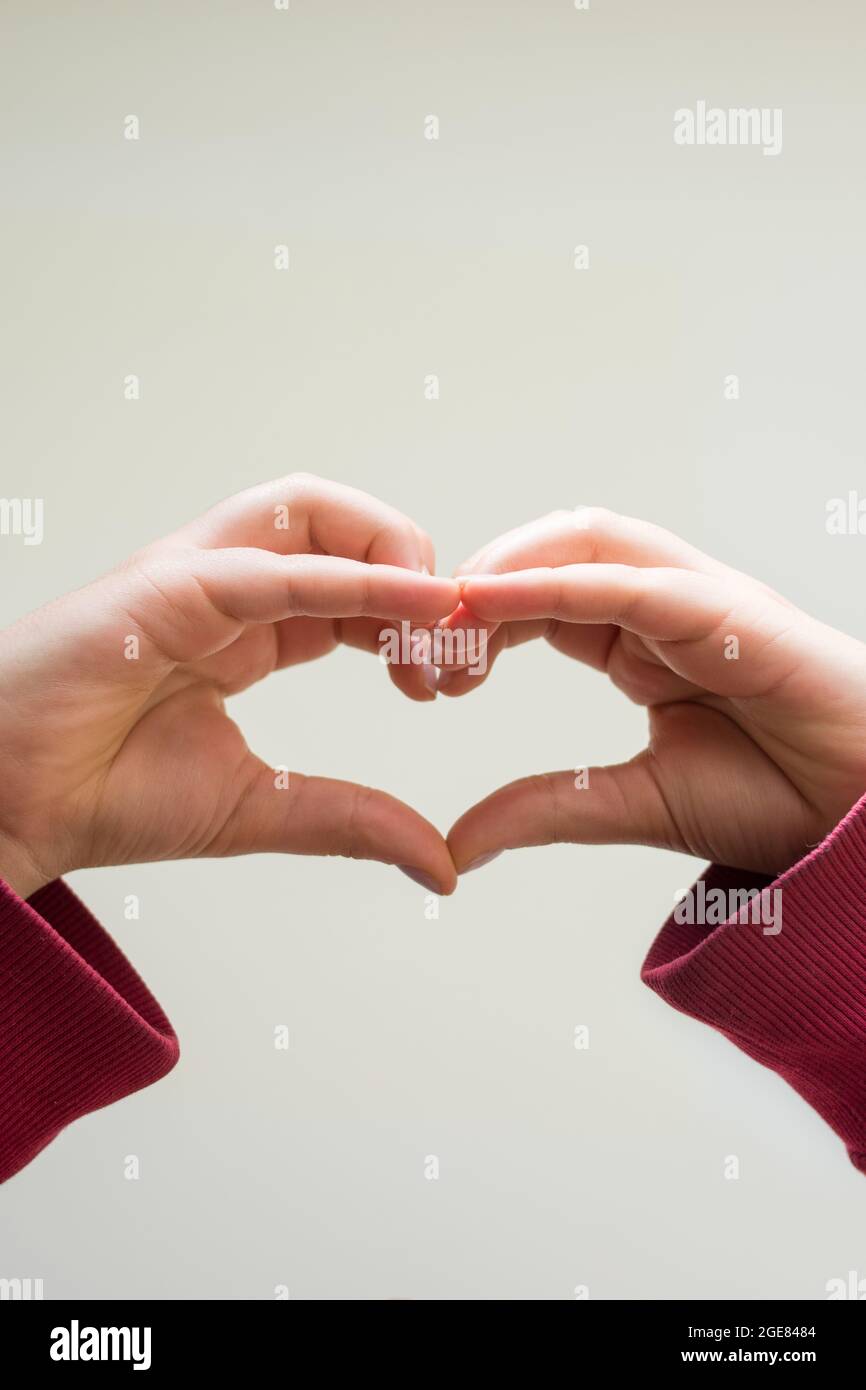 Closeup of hands forming a heart with fingers Stock Photo - Alamy