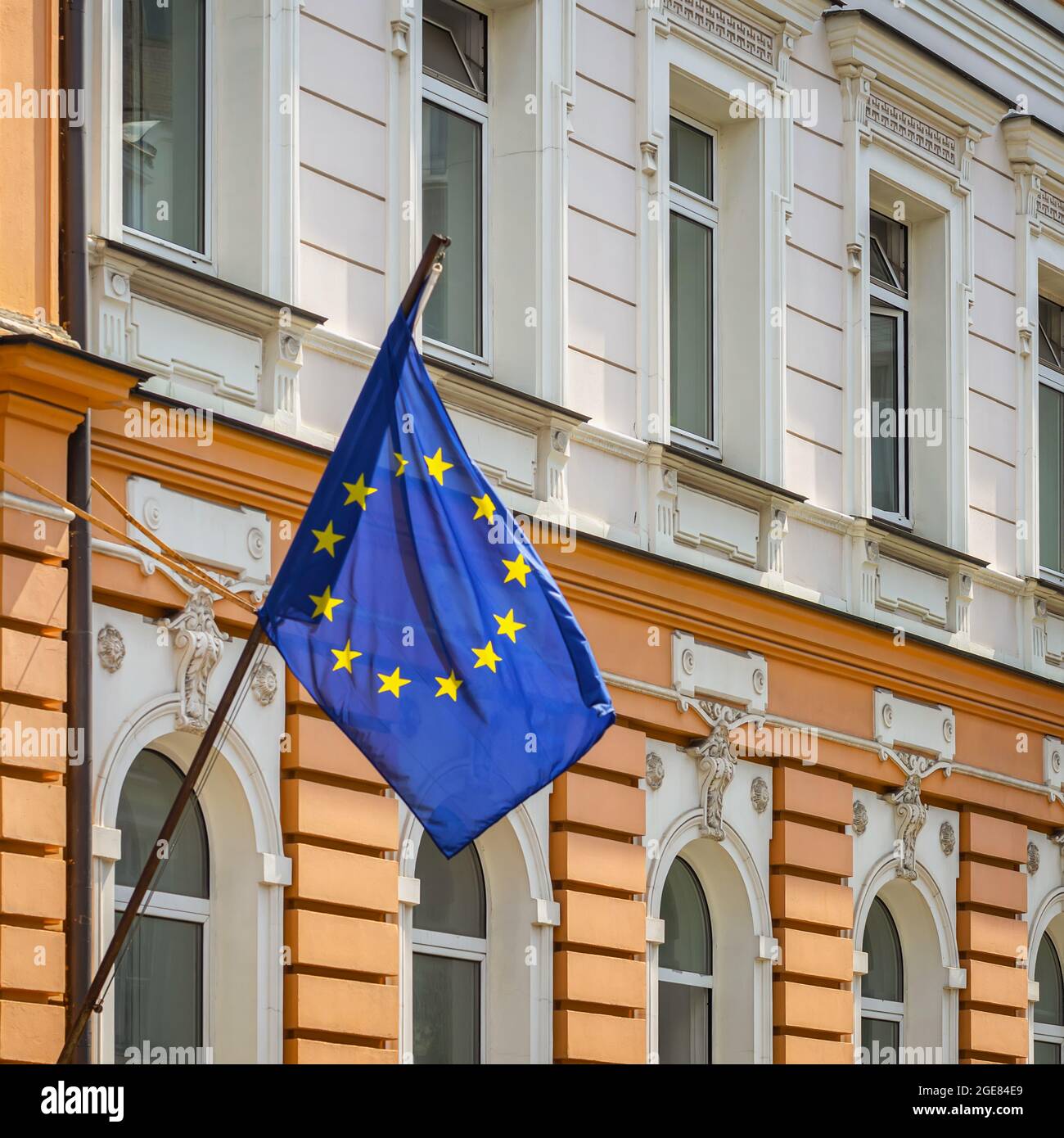 European Union flag waving on wall of European public building Stock ...