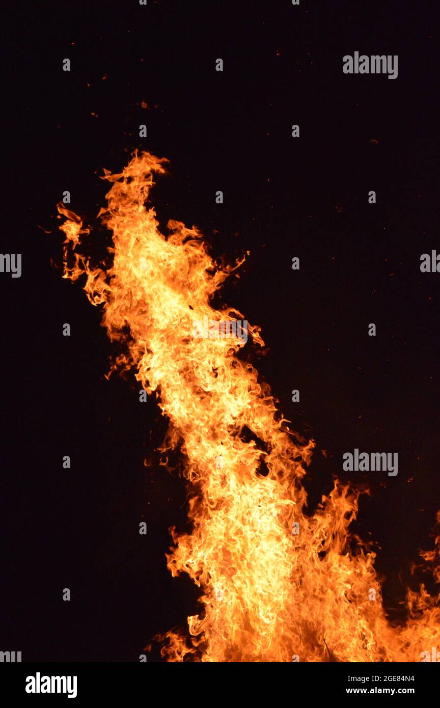 Closeup of fire flames in a darkness Stock Photo - Alamy