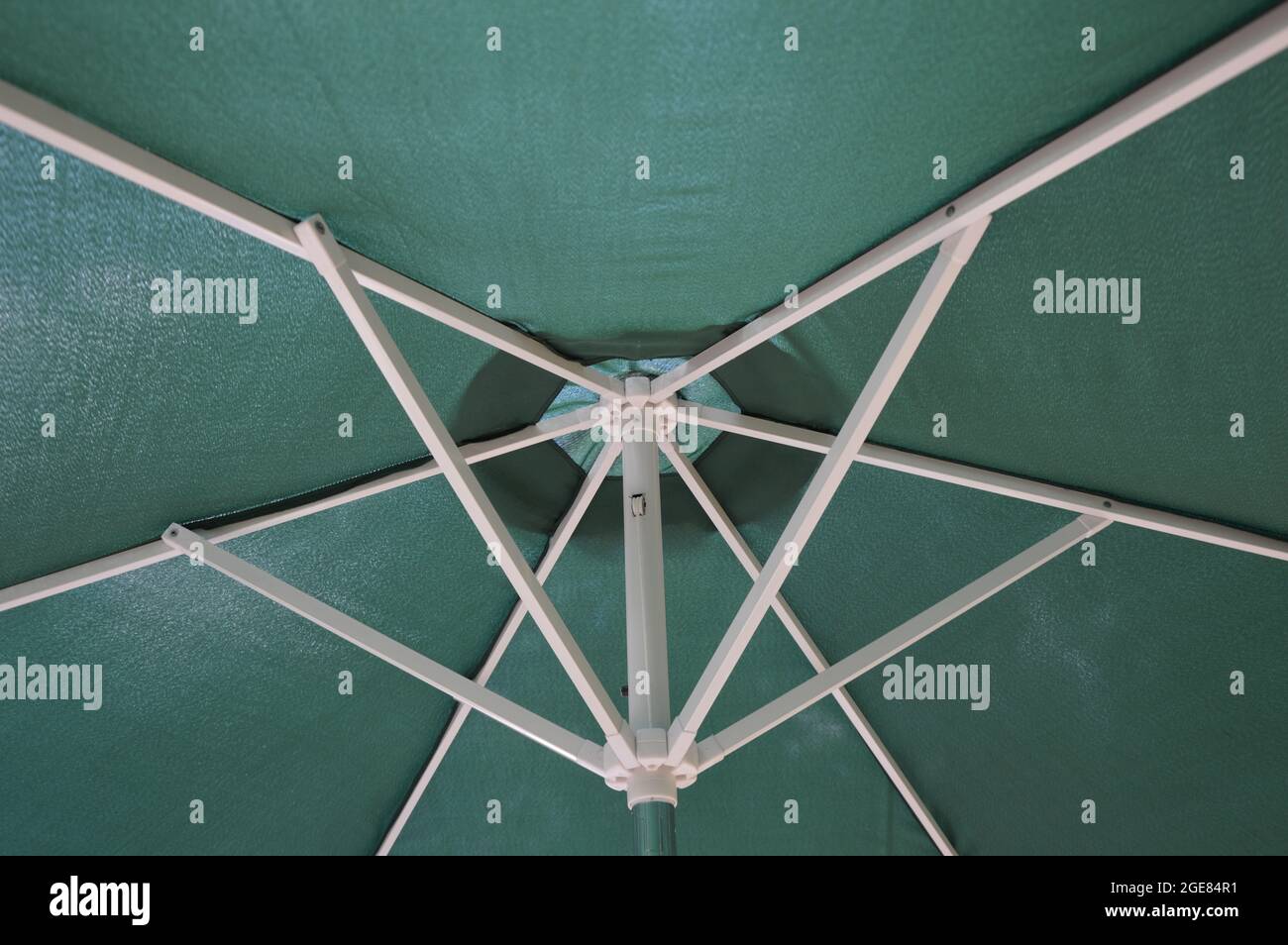 Inside structure of a large green umbrella Stock Photo - Alamy