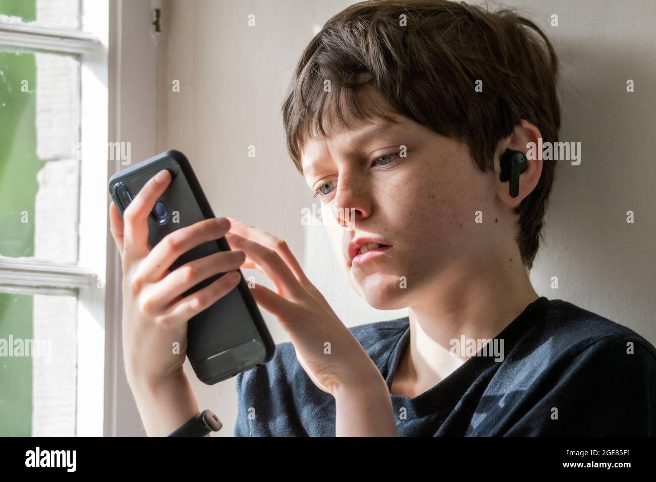 Boy using mobile phone Stock Photo - Alamy