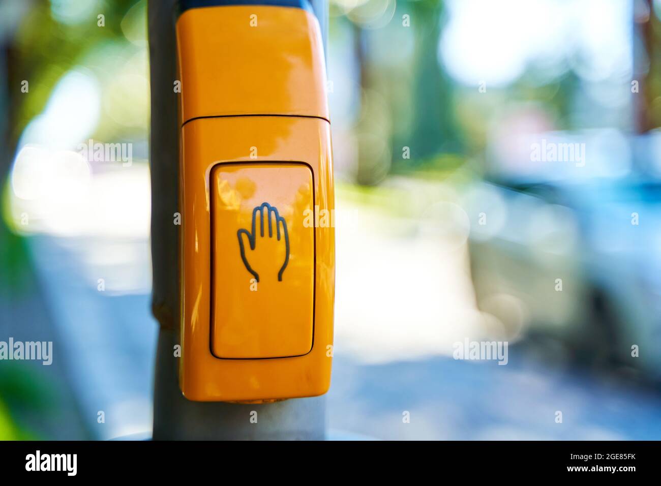 Close-up, yellow button to switch traffic lights Stock Photo - Alamy