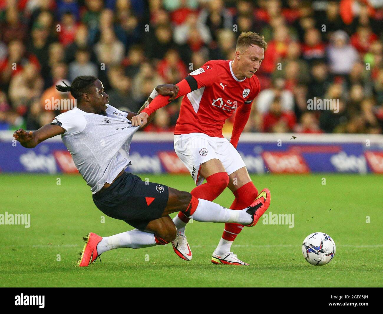 Pelly Ruddock #17 of Luton Town and Cauley Woodrow #9 of Barnsley ...
