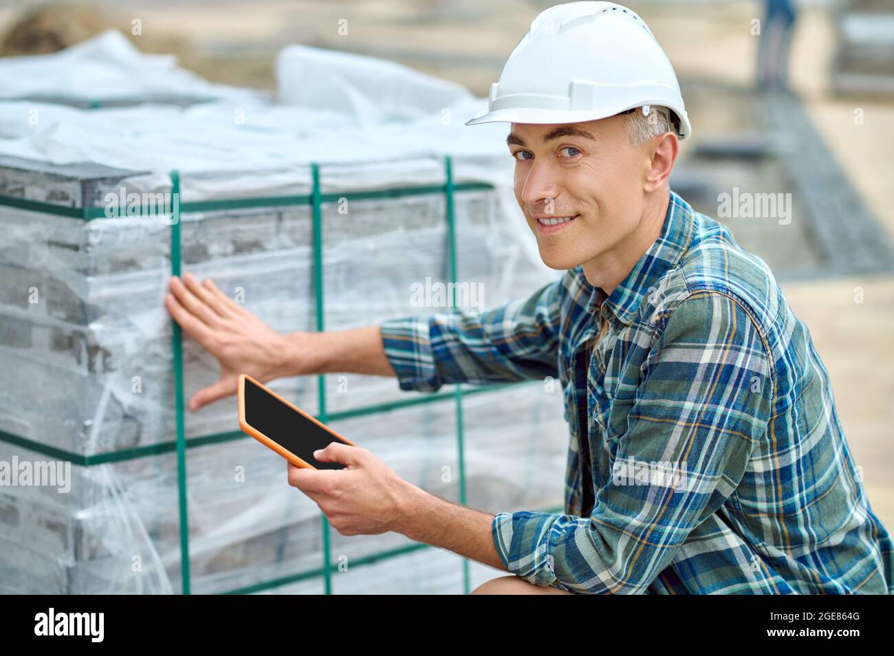 Experienced construction engineer checking the quality of building ...