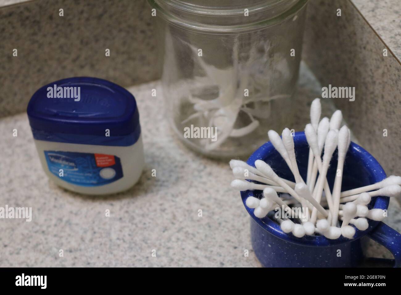 Vaseline, ear swabs and dental floss toothpick Stock Photo - Alamy