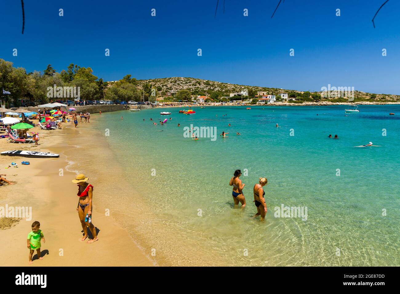 MARATHI, CRETE - 18 JULY 2021: Locals and tourists relaxing on the ...