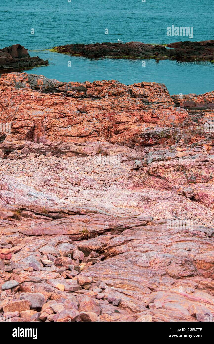 Colorful rock formation around picturesque small town Gudhjem in ...