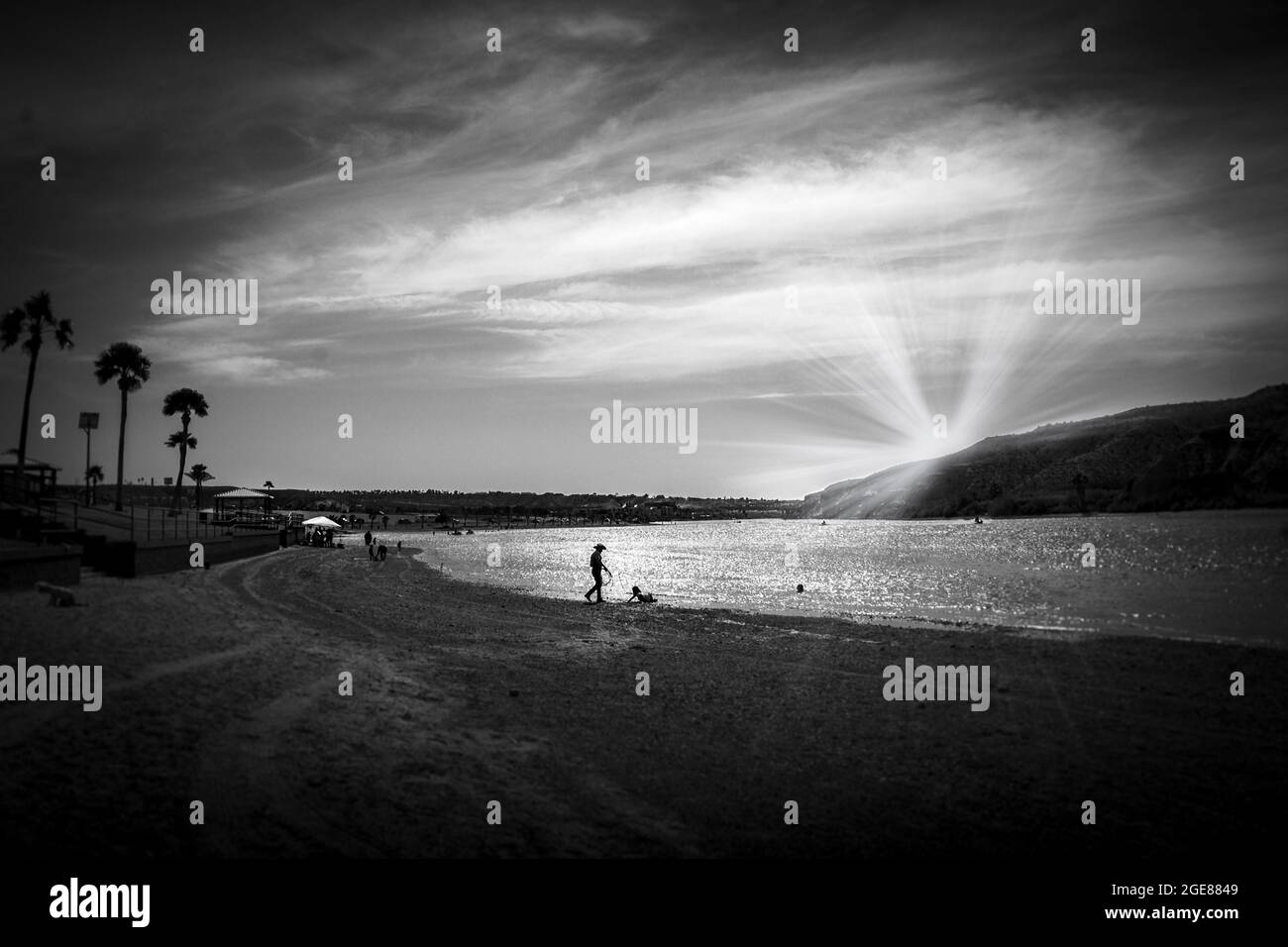 Grayscale shot of a seashore on a sunset Stock Photo - Alamy
