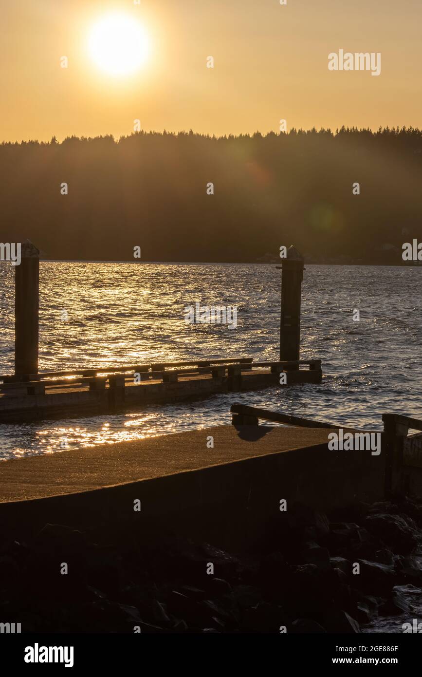 sunset over dock at hood canal in washington state Stock Photo - Alamy