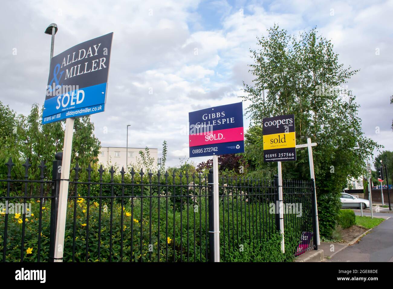 HILLINGDON, LONDON, ENGLAND - 14 August 2021: Sold signs outside block ...