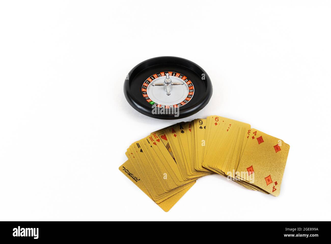 Toy roulette and gold cards isolated on a white background Stock Photo ...