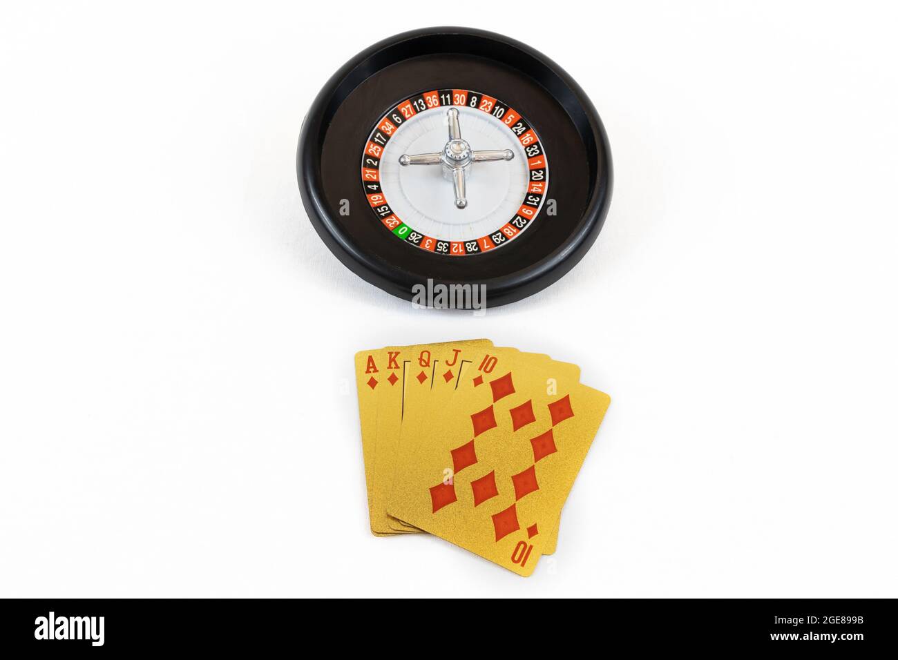 Toy roulette and gold cards isolated on a white background Stock Photo ...