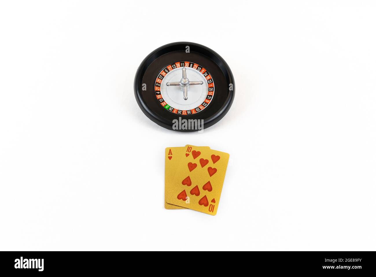 Toy roulette and gold cards isolated on a white background Stock Photo ...