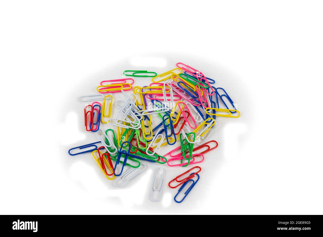 Colorful pile of paper clips on a white background Stock Photo - Alamy