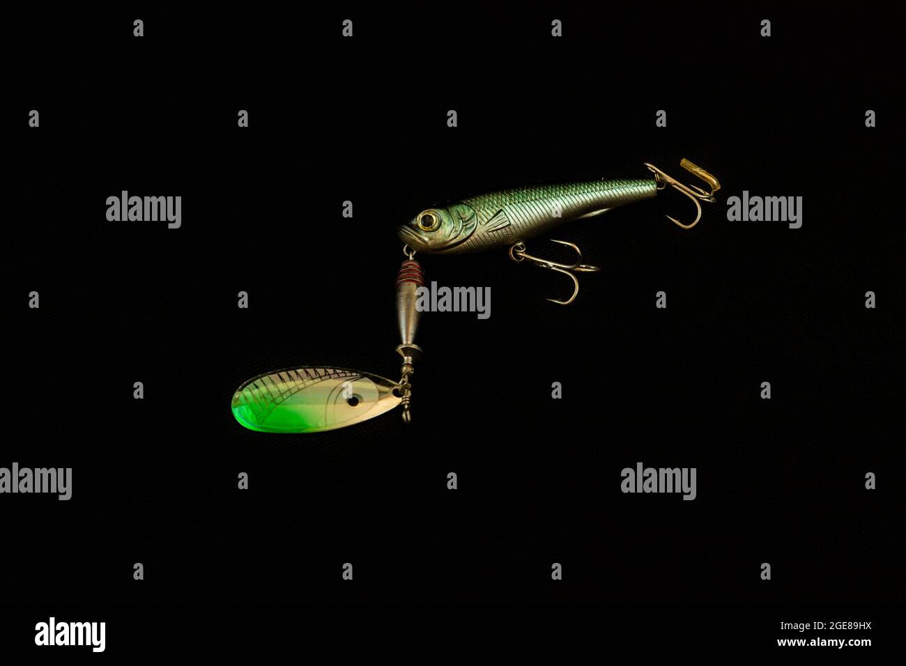 Fish shape wobbler isolated on a black background Stock Photo - Alamy