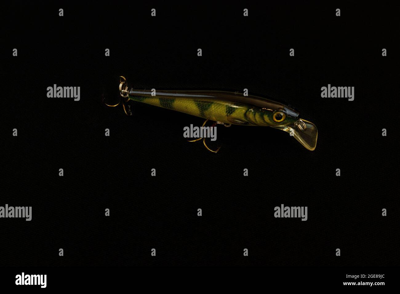 Fish shape wobbler isolated on a black background Stock Photo - Alamy