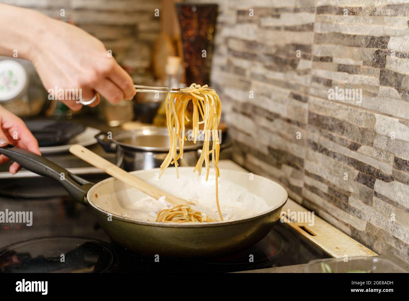 Kitchen hand cooking hi-res stock photography and images - Alamy