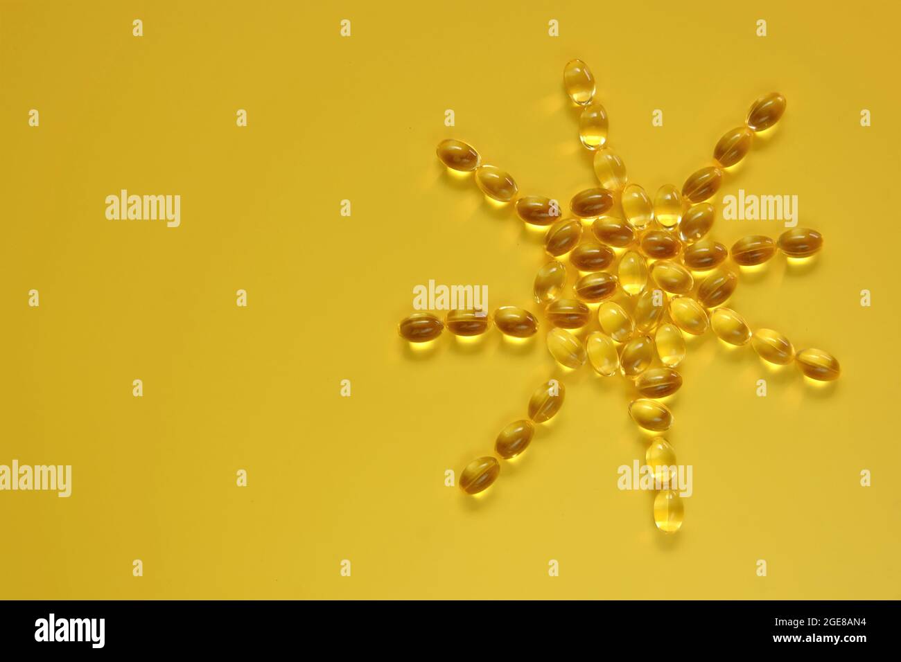 Vitamin D.Sun sign made from vitamin D capsules.gelatin capsules with ...
