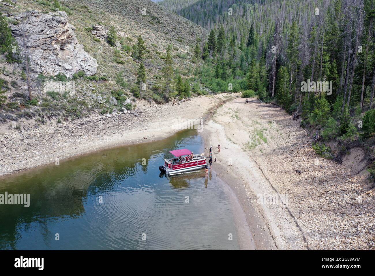 Aerial view of family and friends enjoying afternoon boating on Lake ...